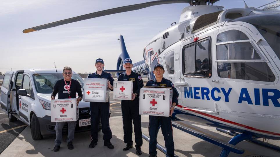 Swapping Military Fatigues for Red Cross Vest
